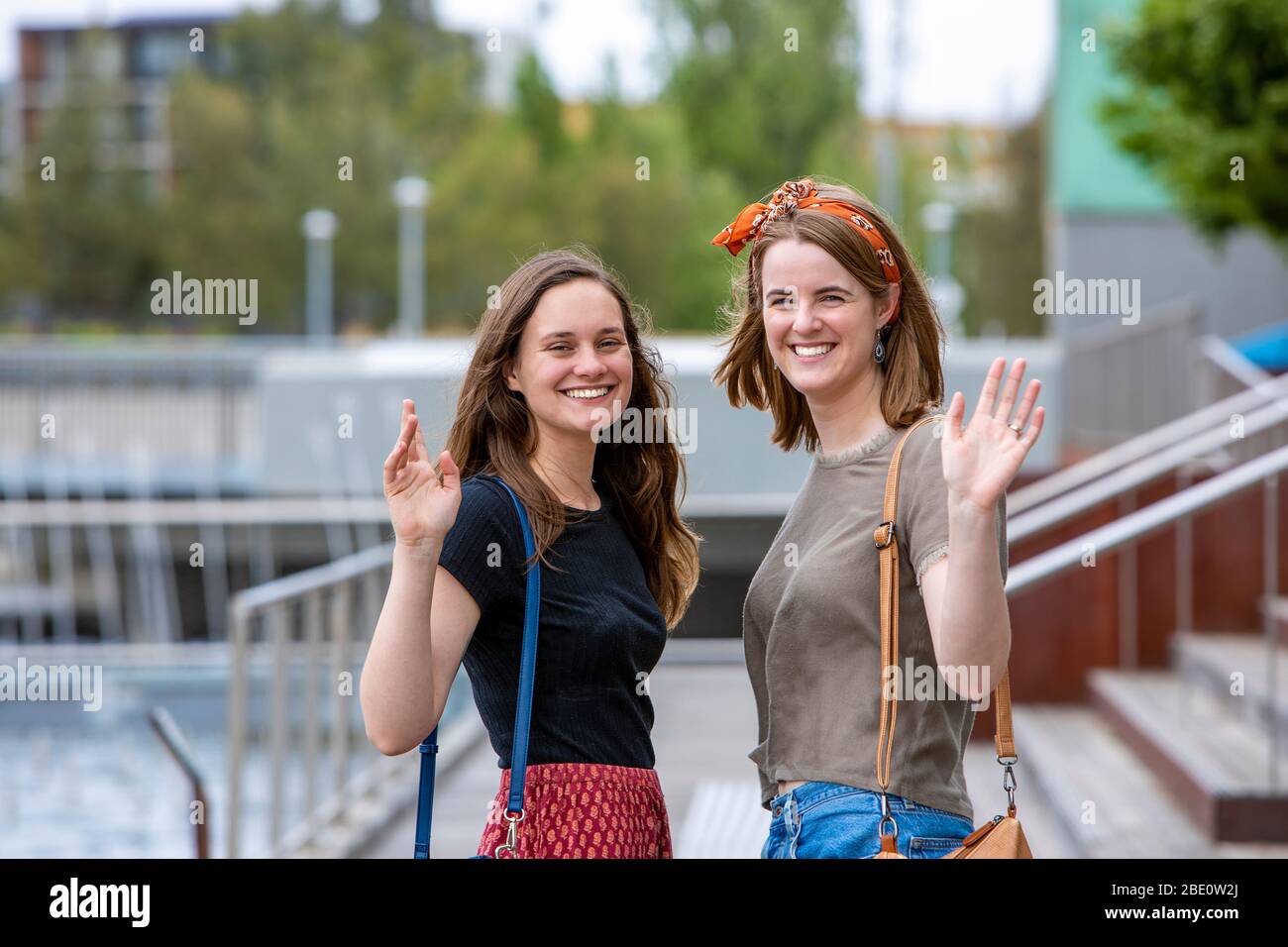 Laughing waving camera hi-res stock photography and images - Alamy