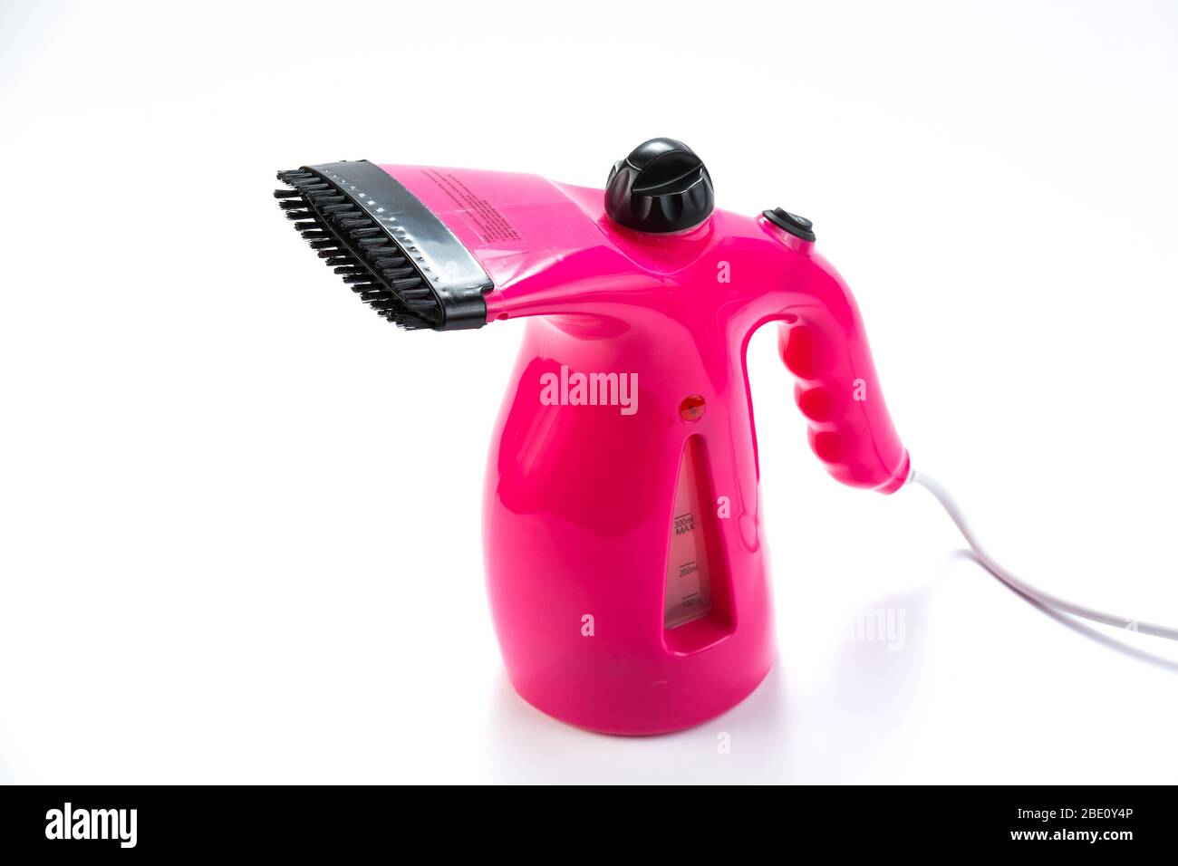 Garment steamer, pink portable iron for home isolated on white ...