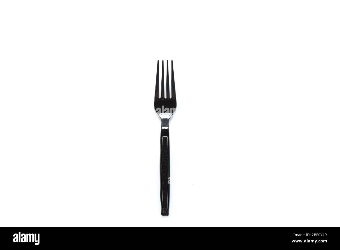 Black plastic fork isolated on white background Stock Photo - Alamy