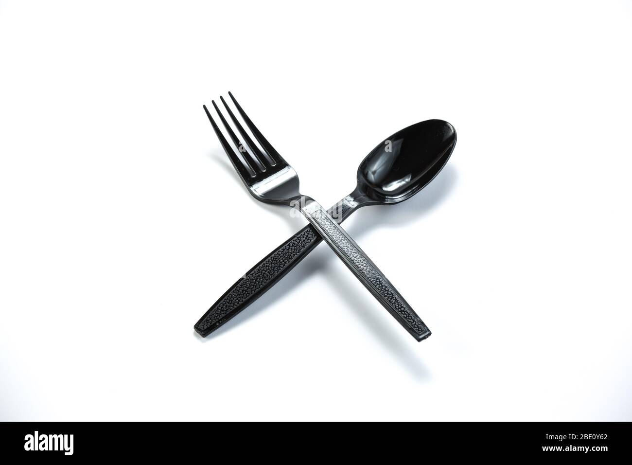 black plastic spoon and fork isolated on white background Stock Photo ...