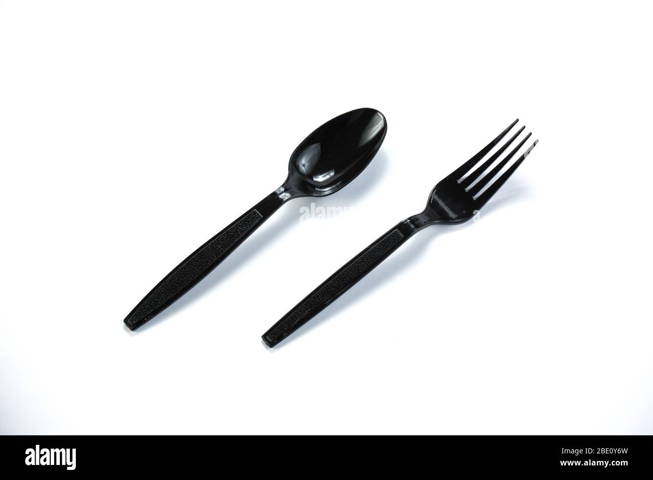 black plastic spoon and fork isolated on white background Stock Photo ...