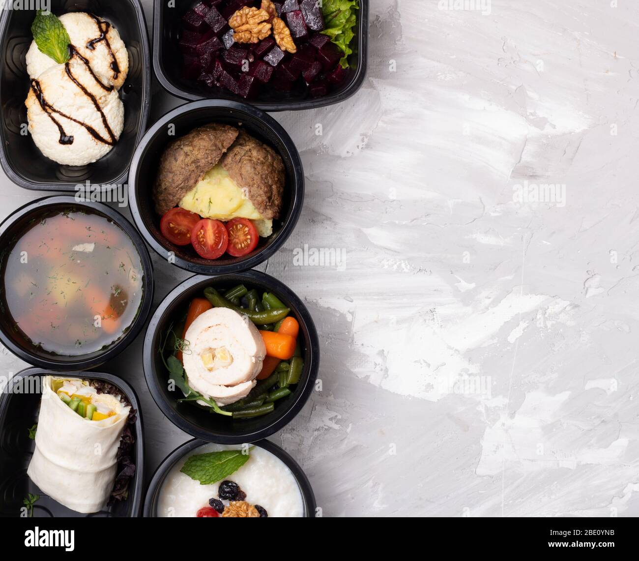 Top view of school lunch boxes with first course meal, copy space ...