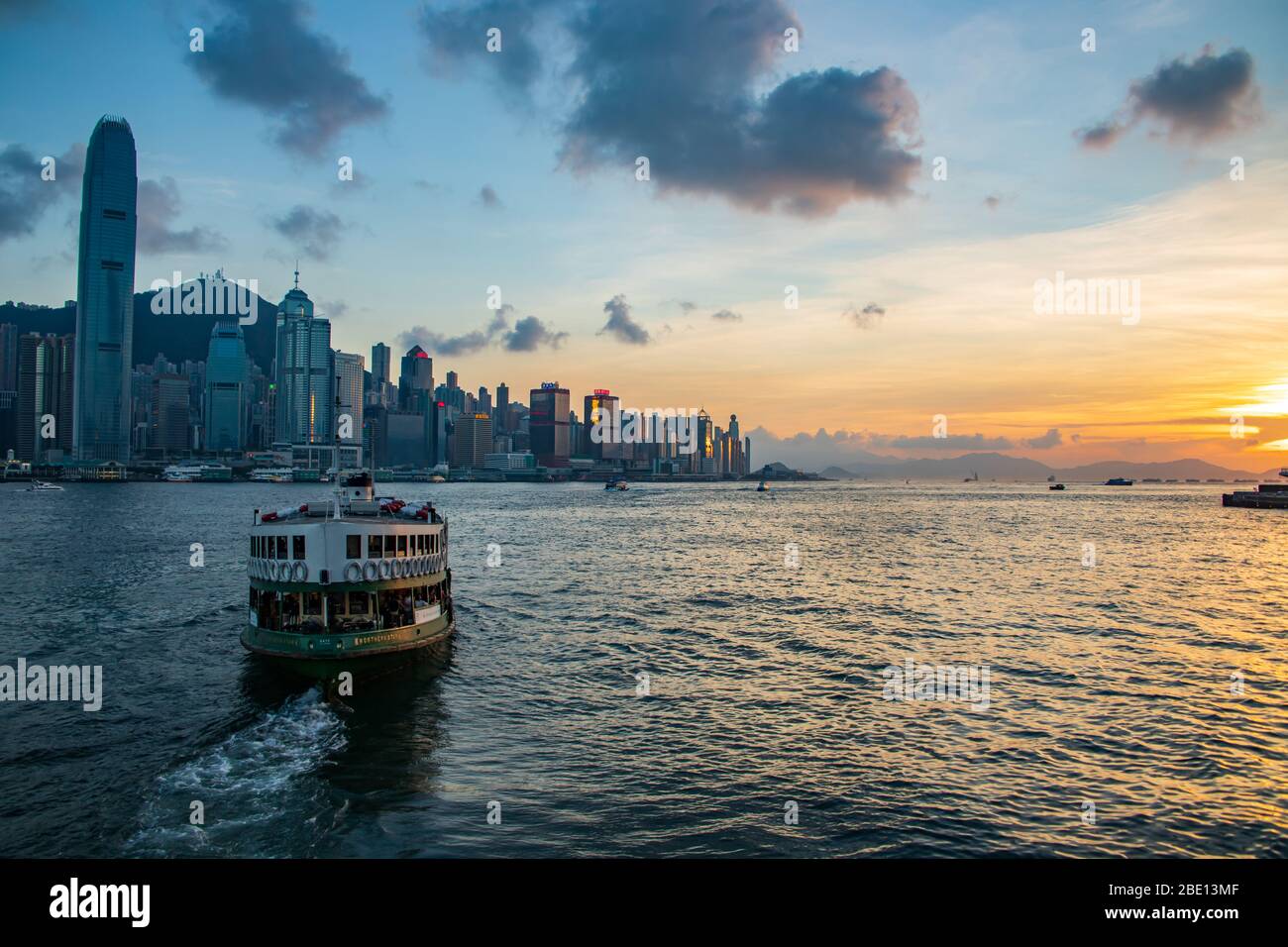 Star ferry of Hong Kong crossing Victoria Harbour at evening time Stock ...