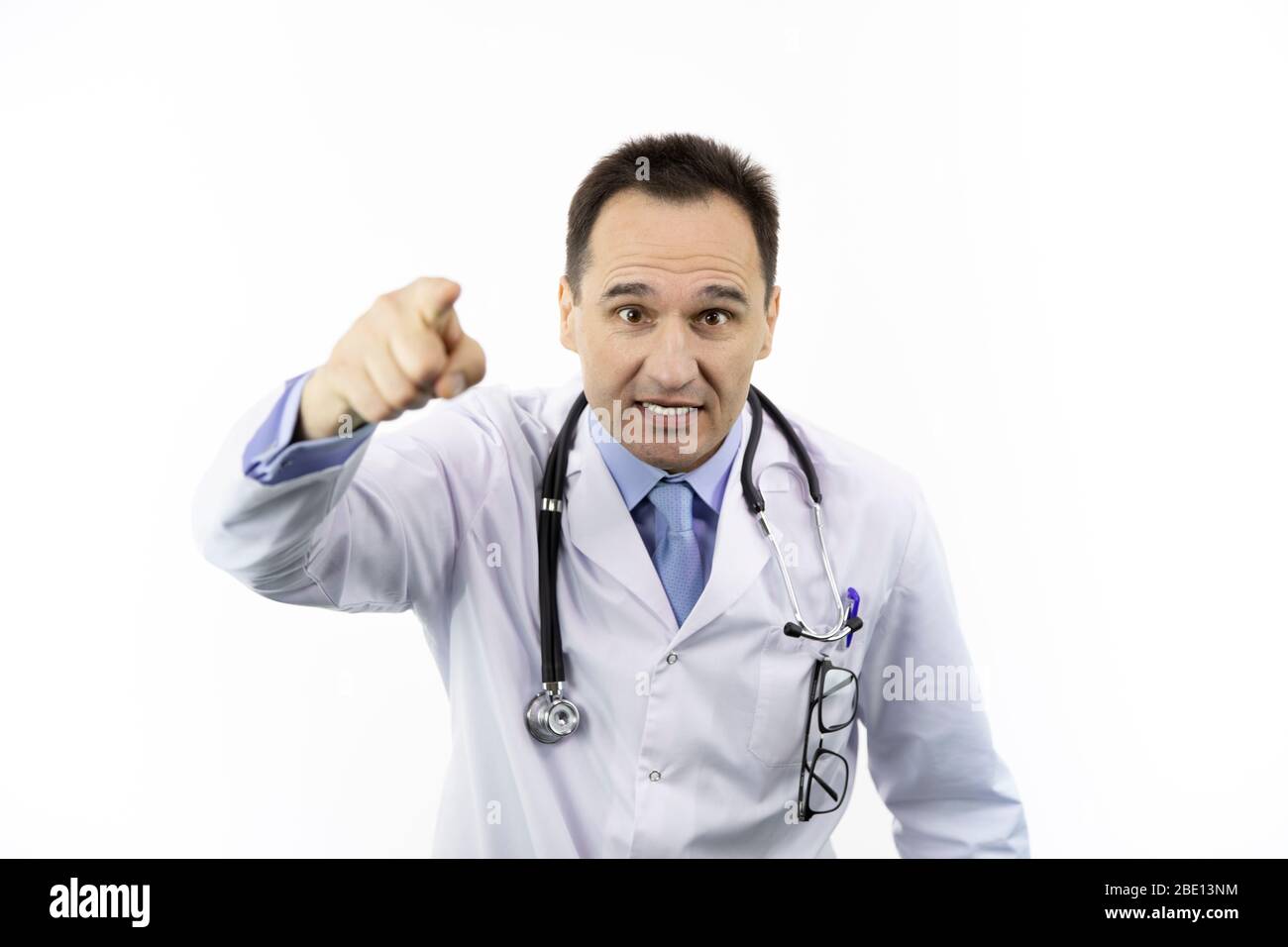 Angry doctor shouting with raised hand pointing finger to you, medical ...