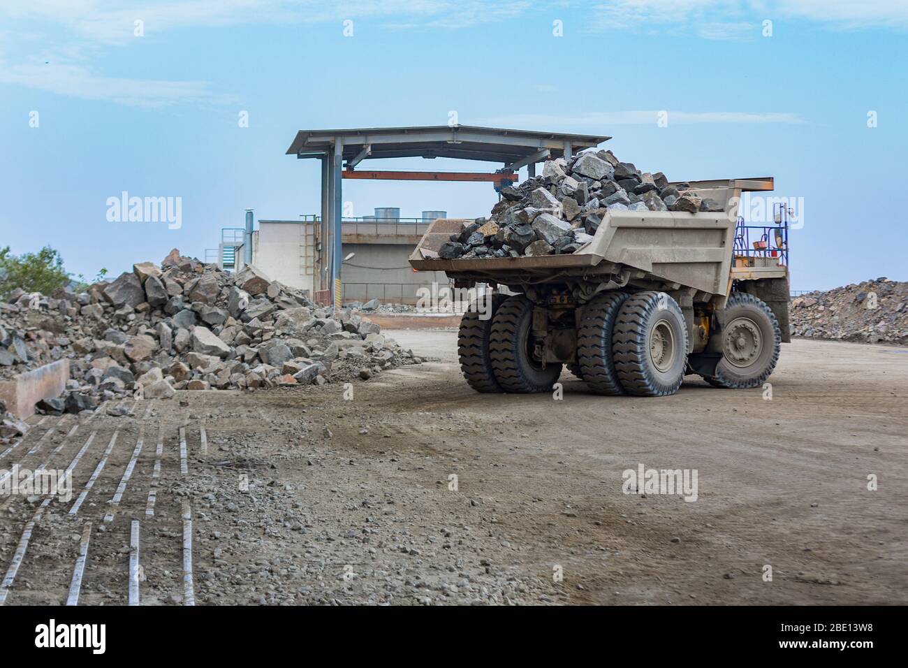 Huge industrial dump truck full loaded back view ready to unloading low ...