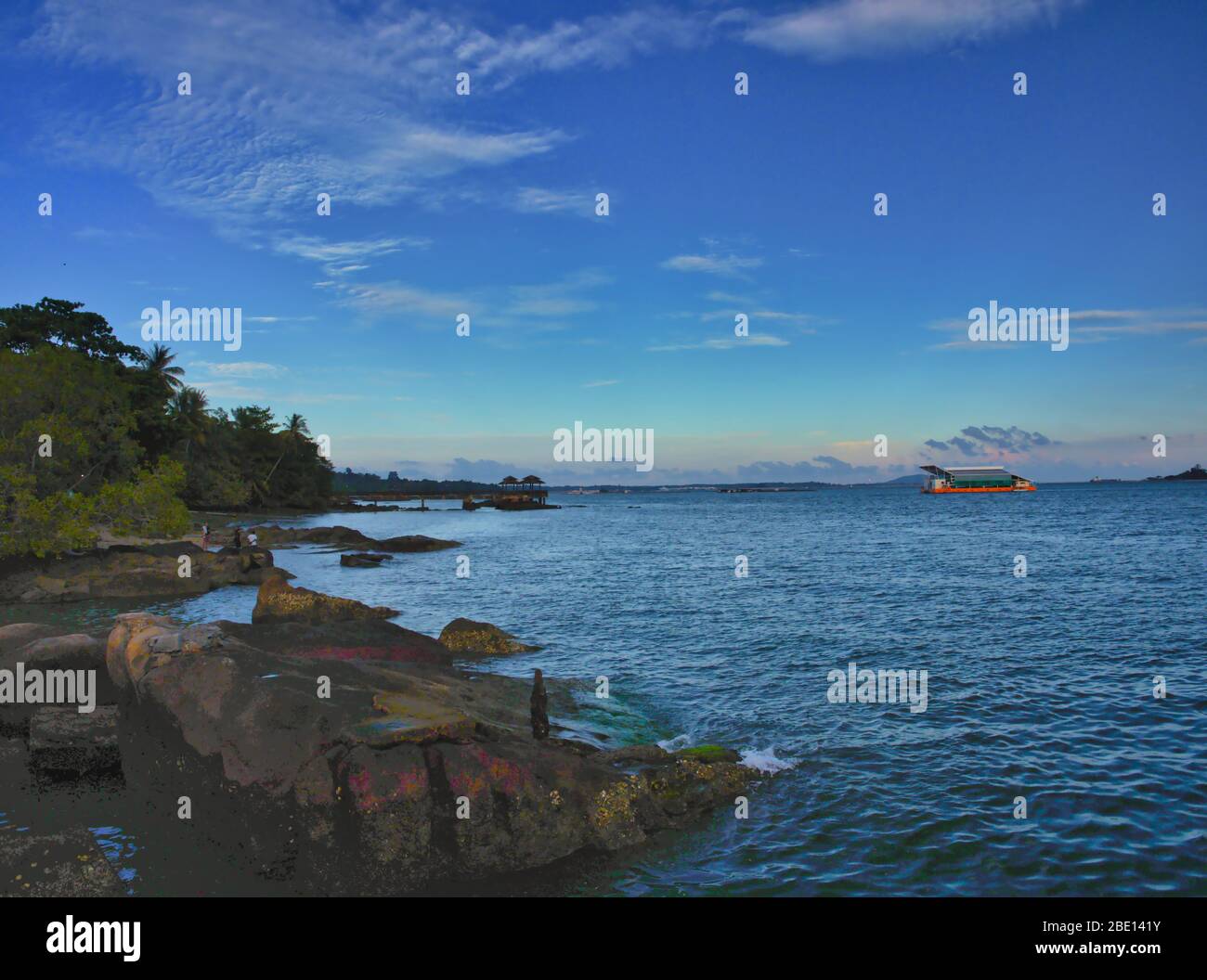 A scenic view from the beach near to the jetty at Pulau Ubin island of ...