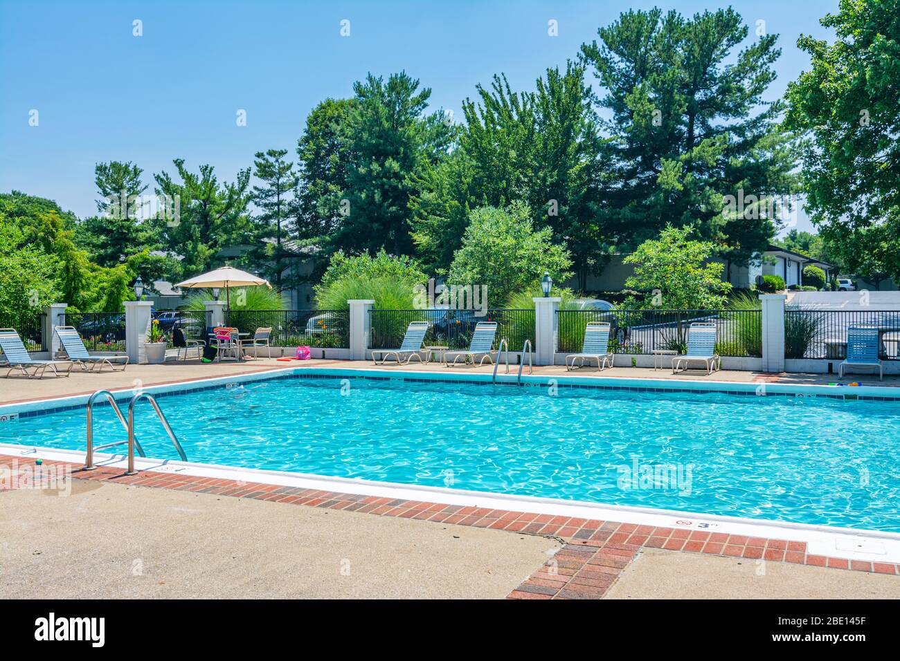 Swimming pool on a beautiful sunny summer day Stock Photo - Alamy