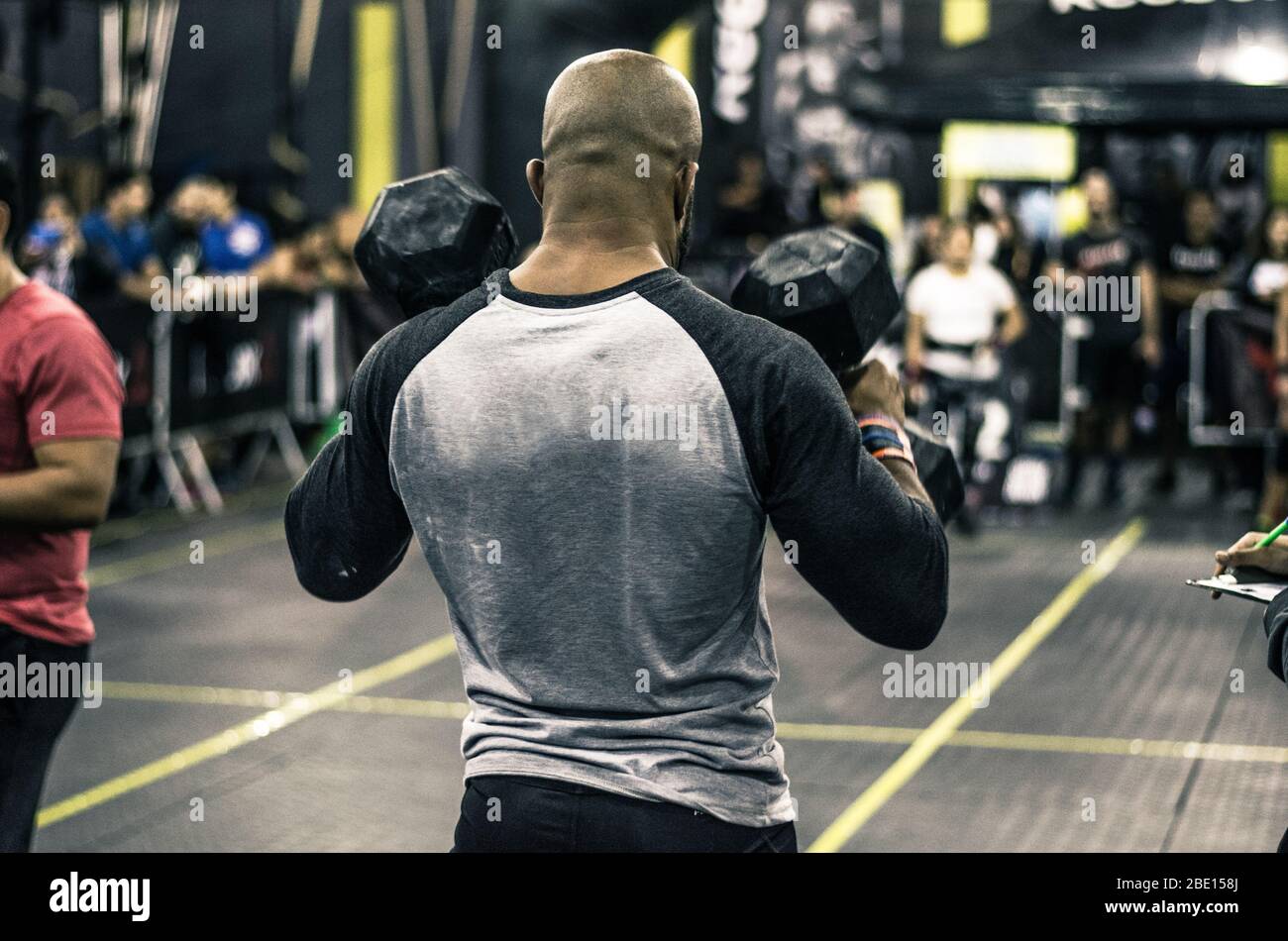 Sport. Muscular african man lifting weights in a gym Stock Photo - Alamy