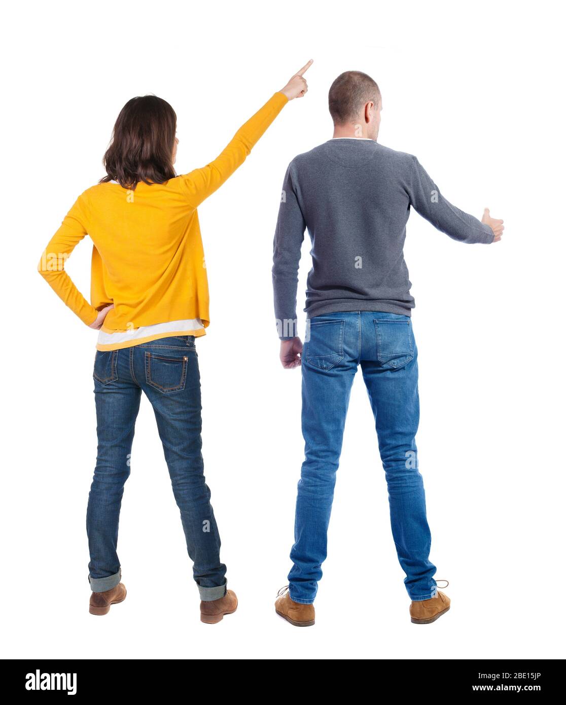 Back view of couple in sweater pointing. Rear view people collection ...
