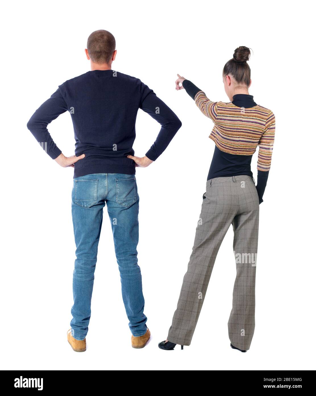 Back view of couple in sweater pointing. Rear view people collection ...