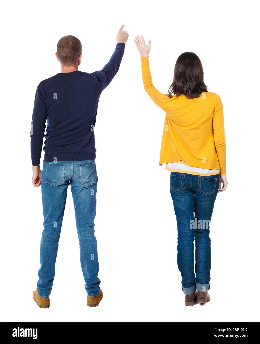 Back view of couple in sweater pointing. Rear view people collection ...