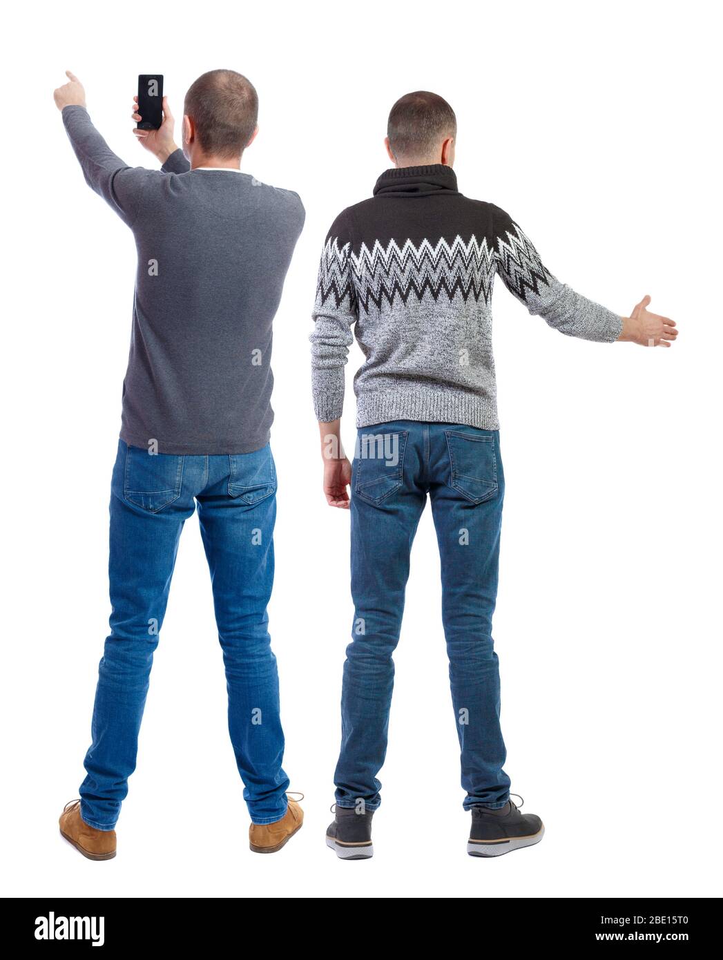 Back view of two man in sweater with mobile phone. Rear view people ...