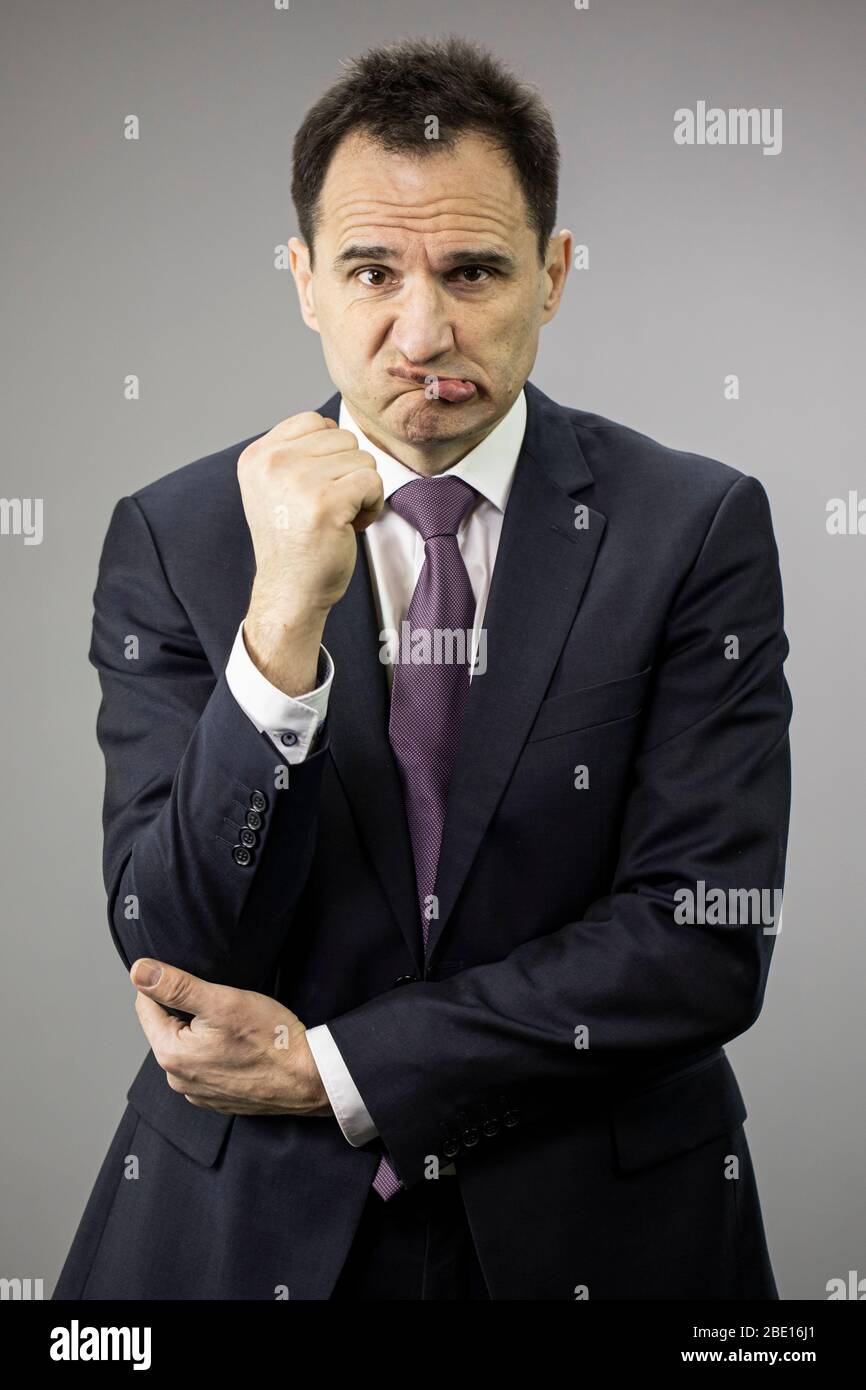Frustrated businessman keep staying strong during difficult economic ...