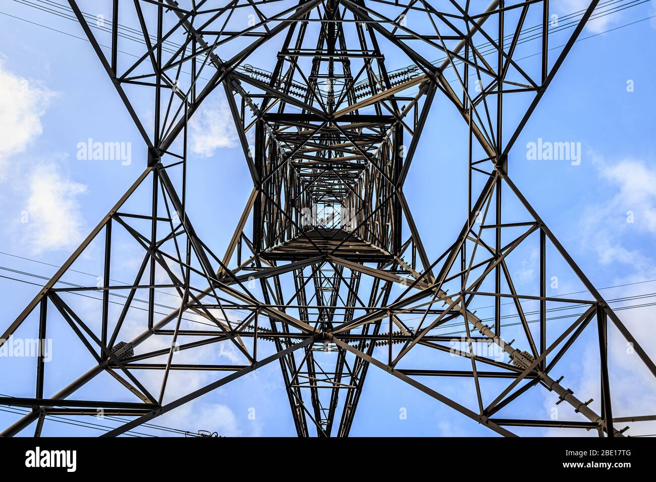 Bottom up view of a lattice power tower Stock Photo - Alamy