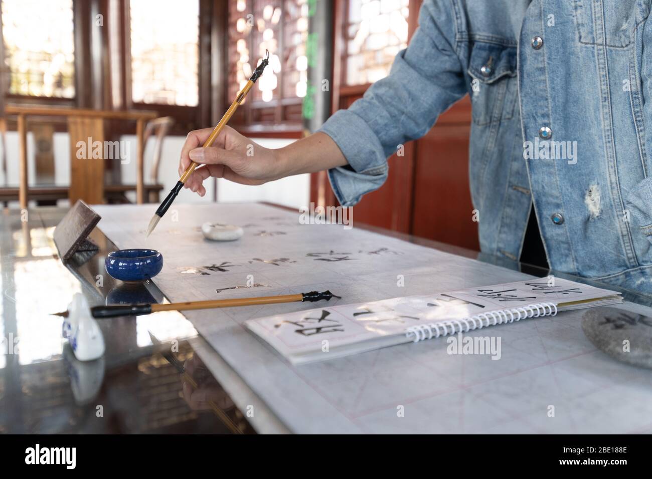 Traveller learn to write Chinese characters, calligraphy is the ...