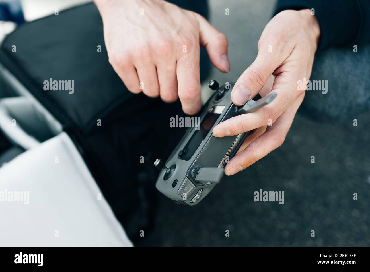 Drone remote control. Remote control in hand man. Man holds remote ...