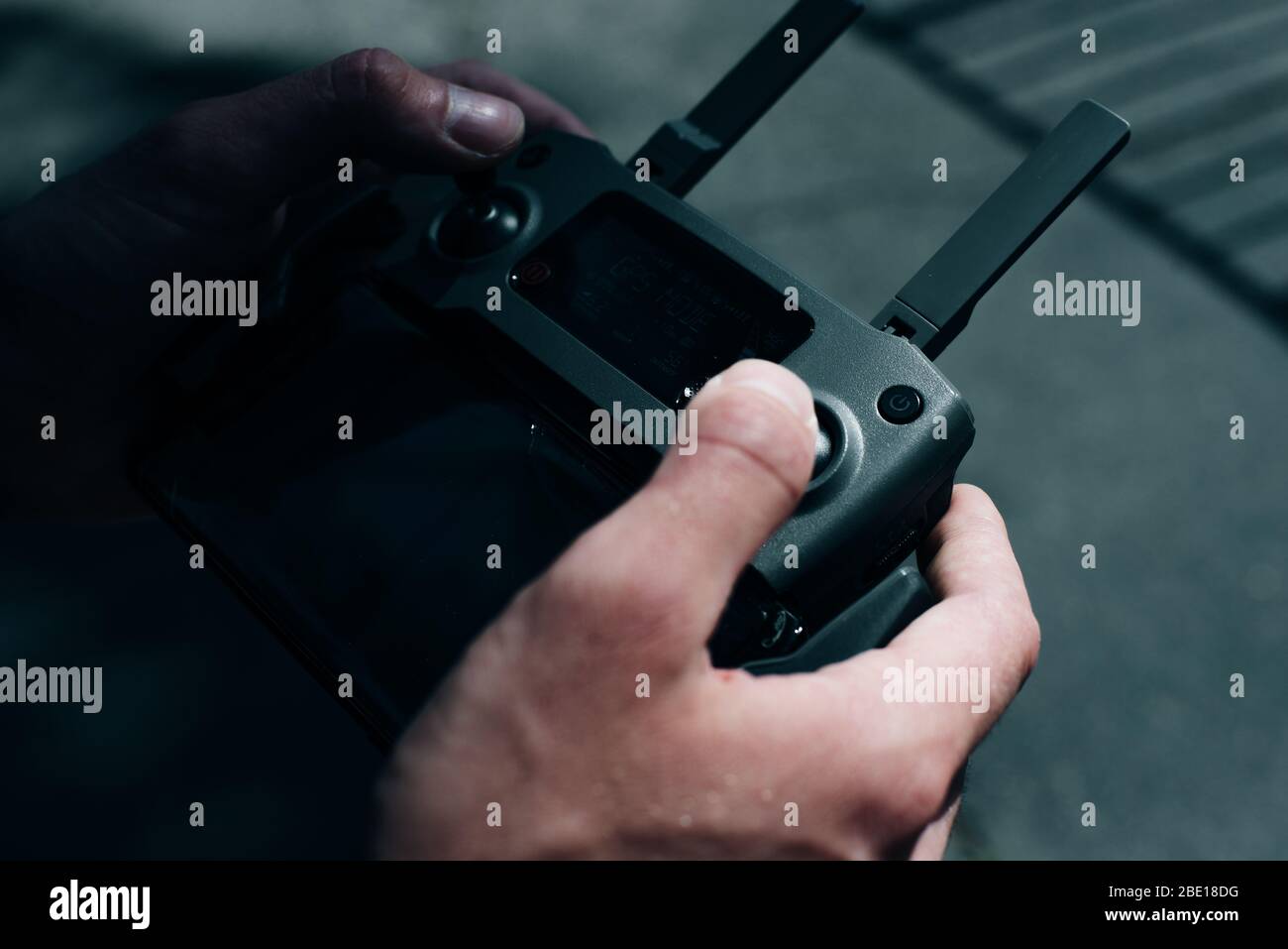 Drone remote control. Remote control in hand man. Man holds remote ...