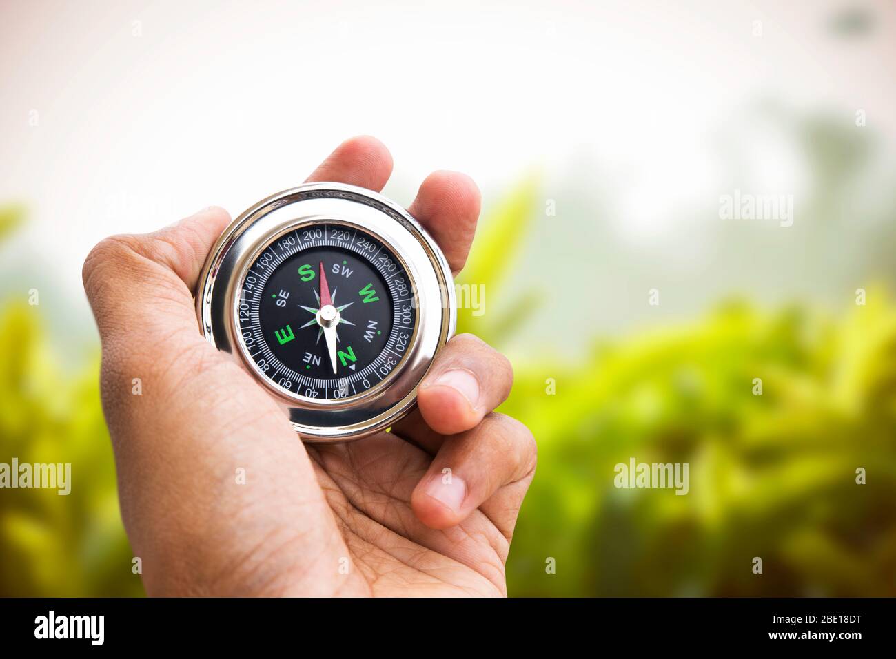 Hand with compass hi-res stock photography and images - Alamy