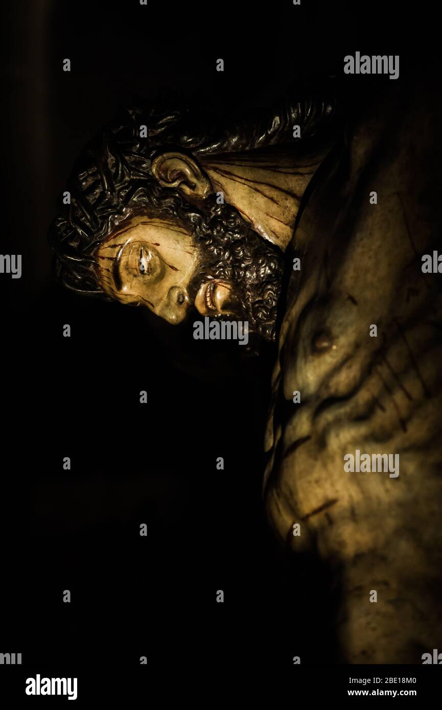 Jesus Christ crucified sculpture isolated on black Stock Photo - Alamy