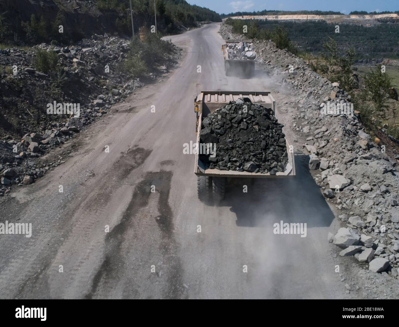 Huge on road dumper in stone quarry loaded transporting granite shot ...
