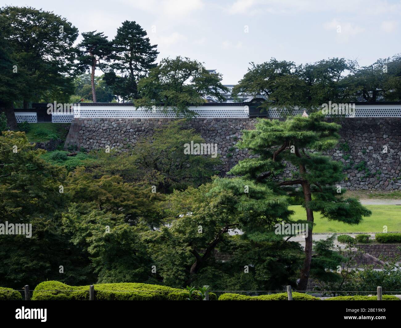 High stone wall of traditional Japanese castle in Kanazawa Stock Photo ...