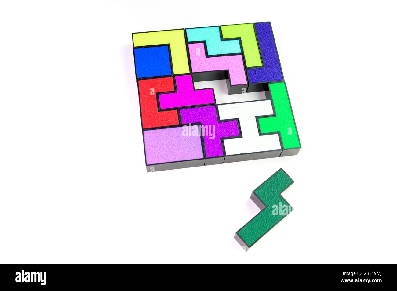 Multi-colored puzzle made of plastic blocks, that's missing a piece ...