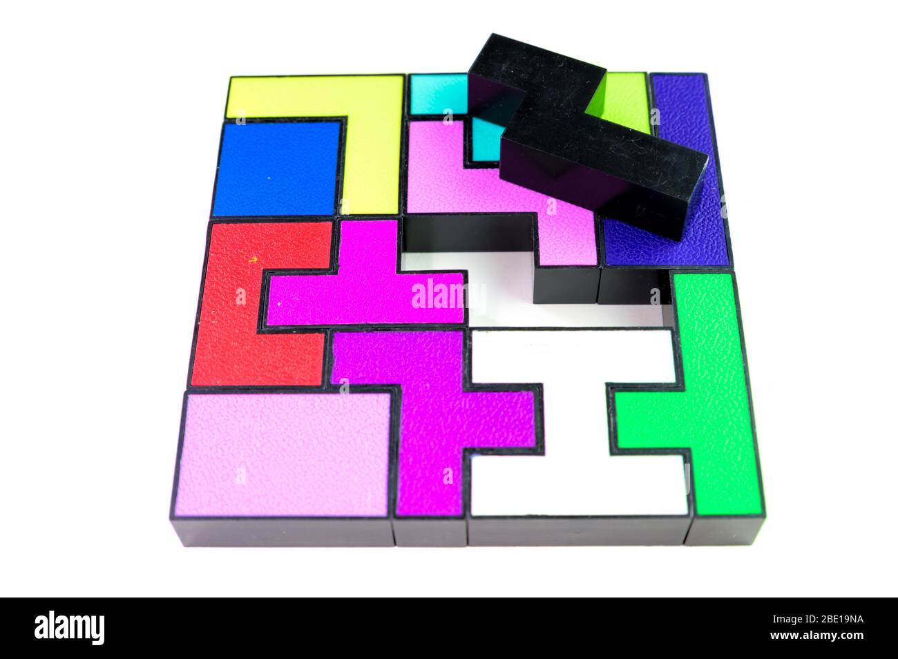 Multi-colored puzzle made of plastic blocks, that's missing a piece ...