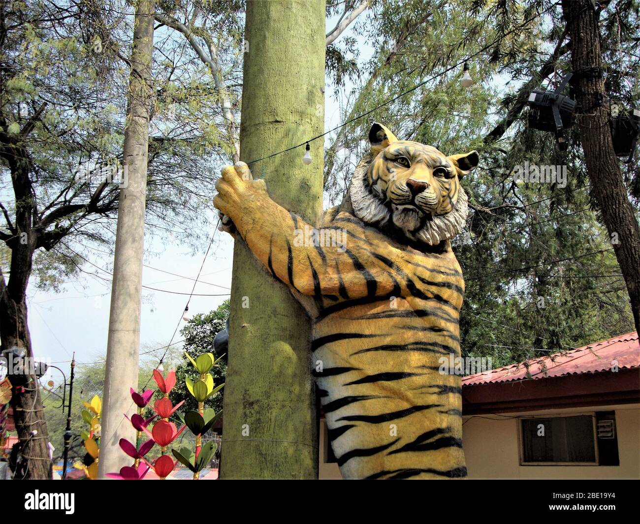 Deadly replica of a standing striped lion holding hi-res stock ...