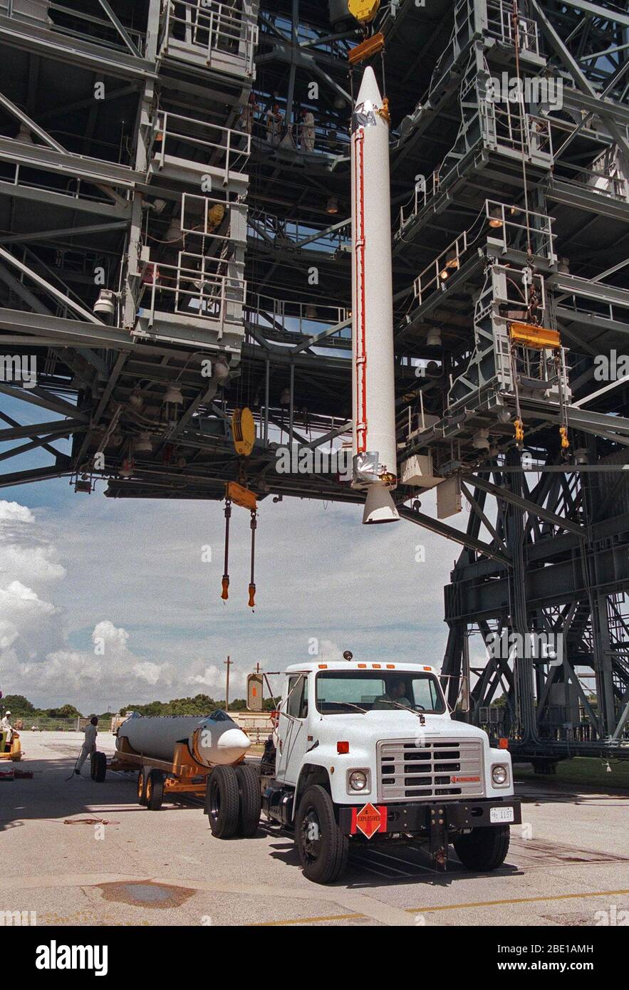 A booster is lifted off a truck for installation onto the Boeing Delta ...