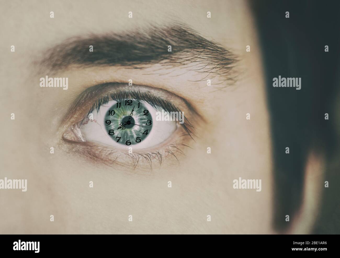 Clock face inside a human eye. Close up shot, shallow depth of field ...