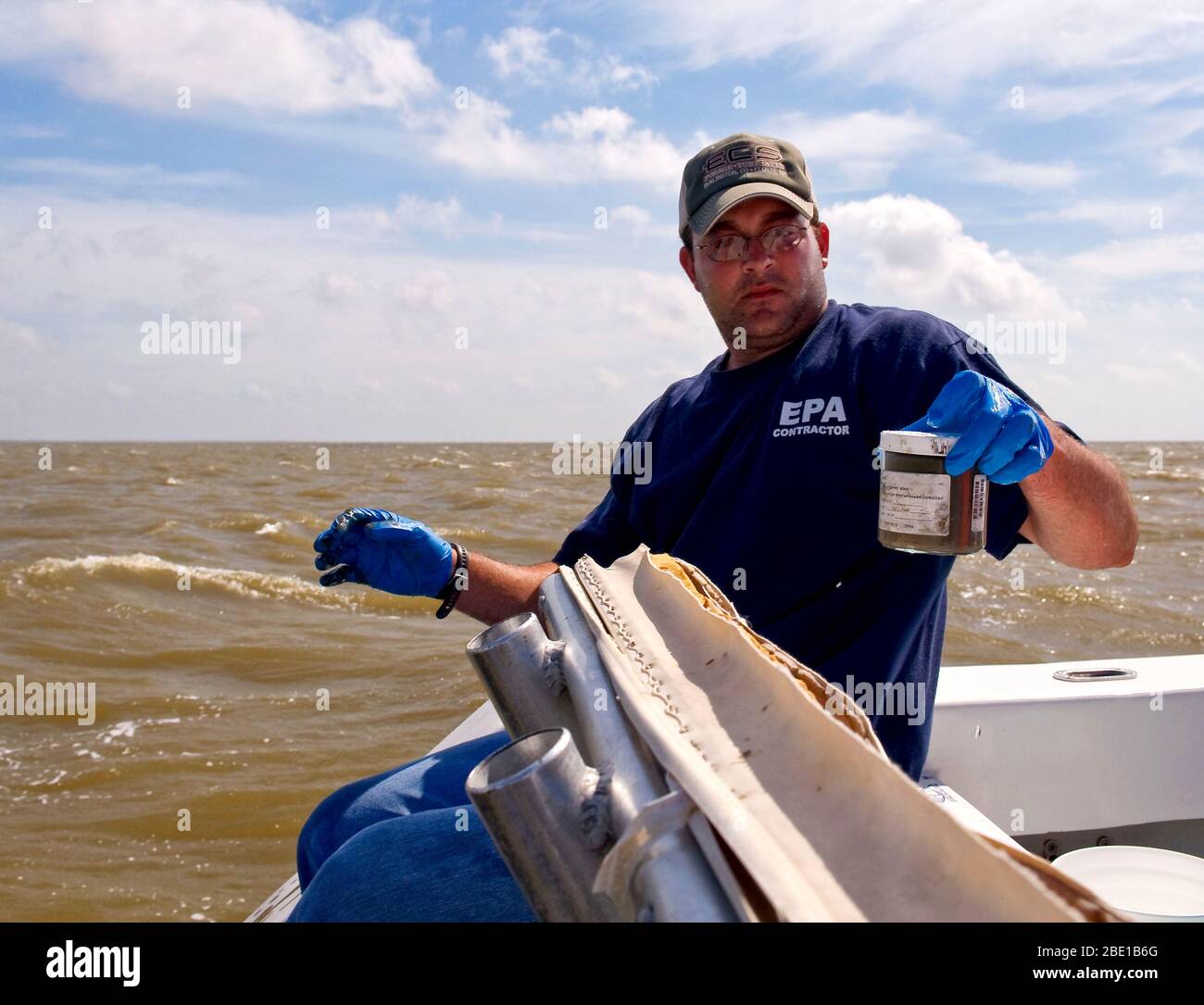 An EPA contractor taking sediment samples in the Gulf of Mexico during ...