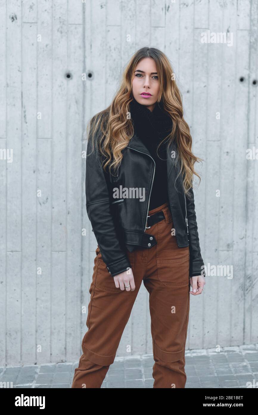 Beautiful young blonde female fashion model wearing urban outfit at a ...