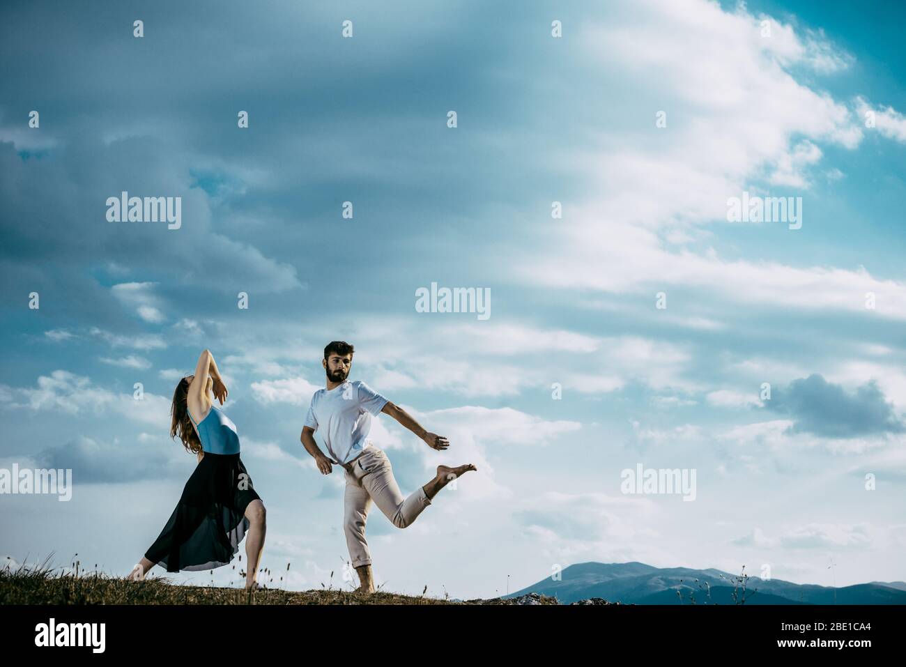 Couple man and woman exercising fitness zumba dancing outdoors Stock ...