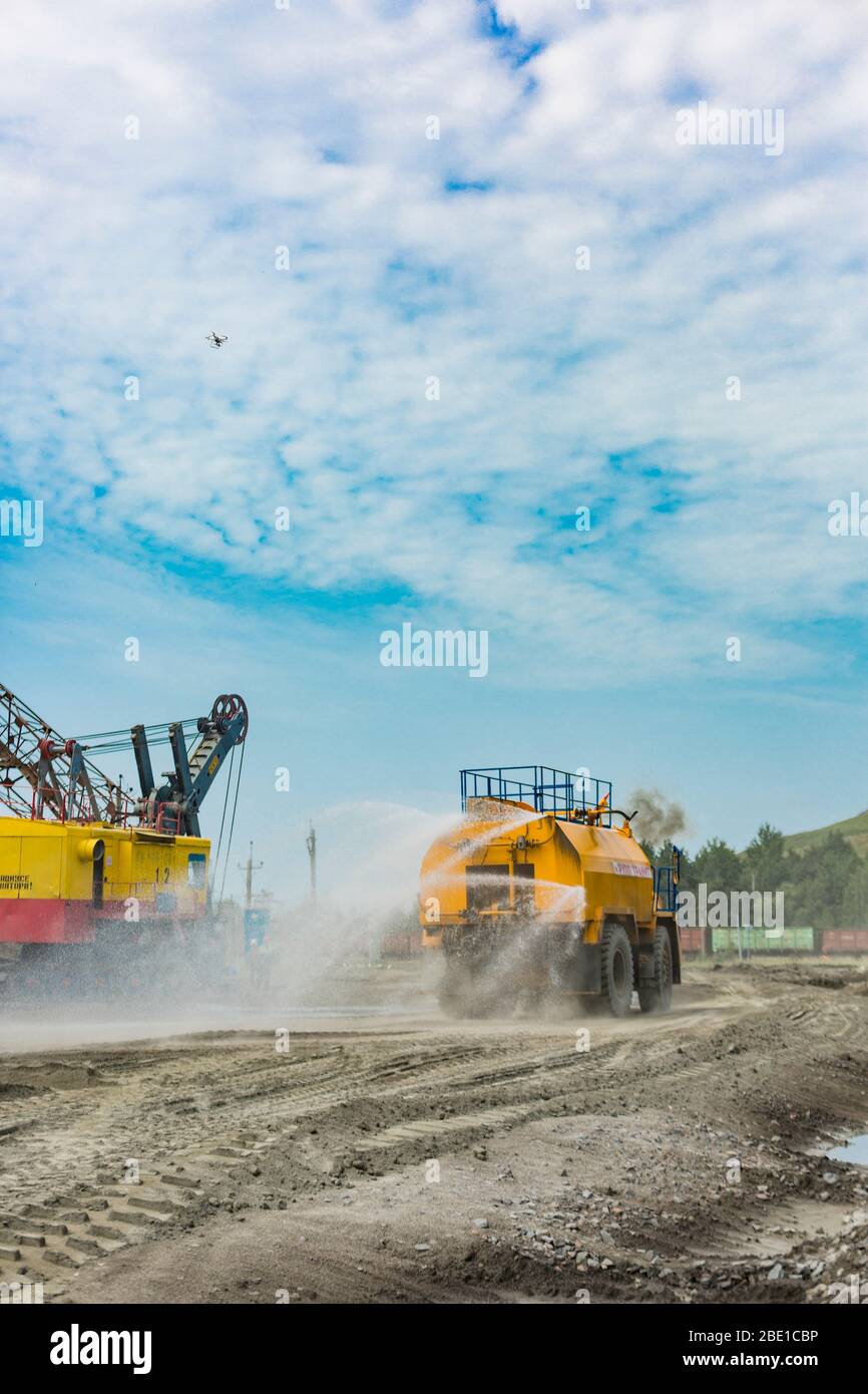 Huge sprinkler sprays water on dust in the mining industry Stock Photo ...