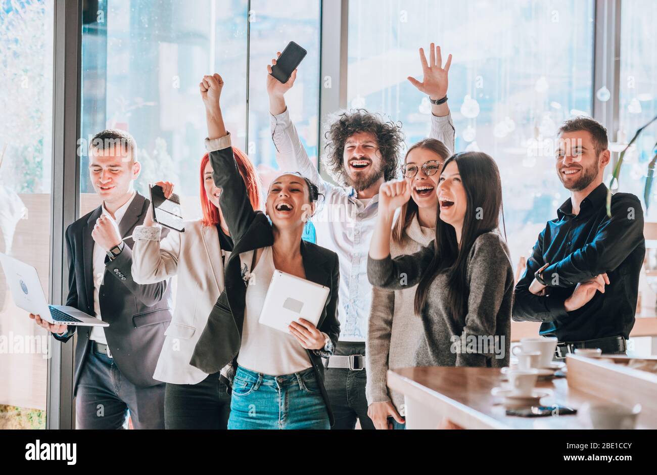 Group of work happy colleagues having fun at a coffee shop Stock Photo ...