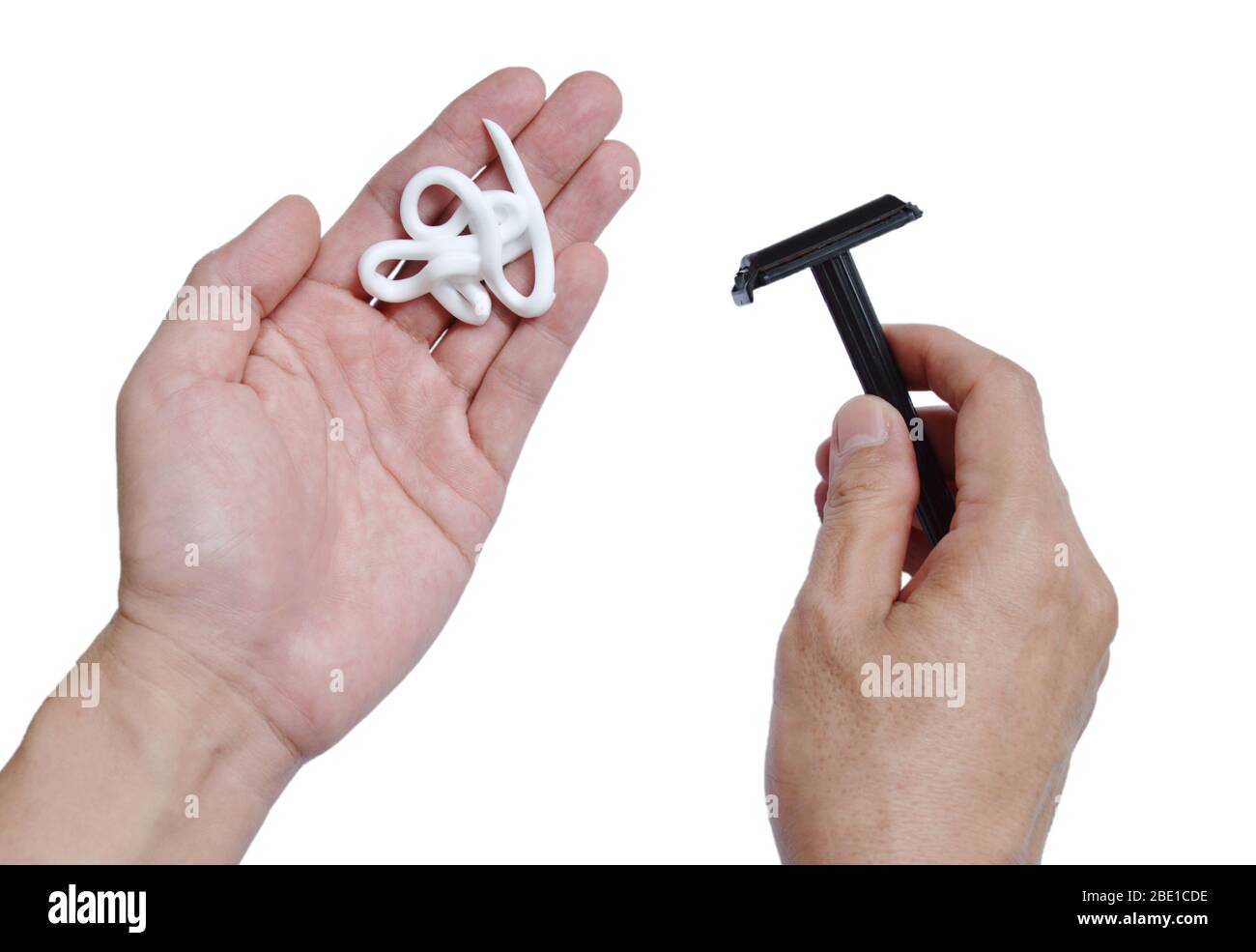shaving cream on left hand and picking black shaver in right Stock ...