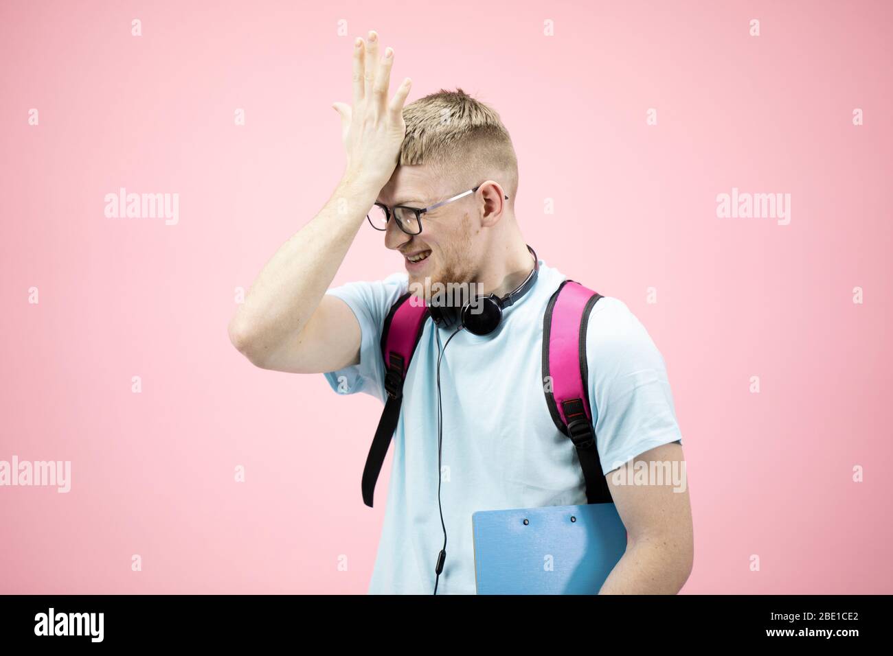 Portrait of student after failed exam making gesture of the face ...