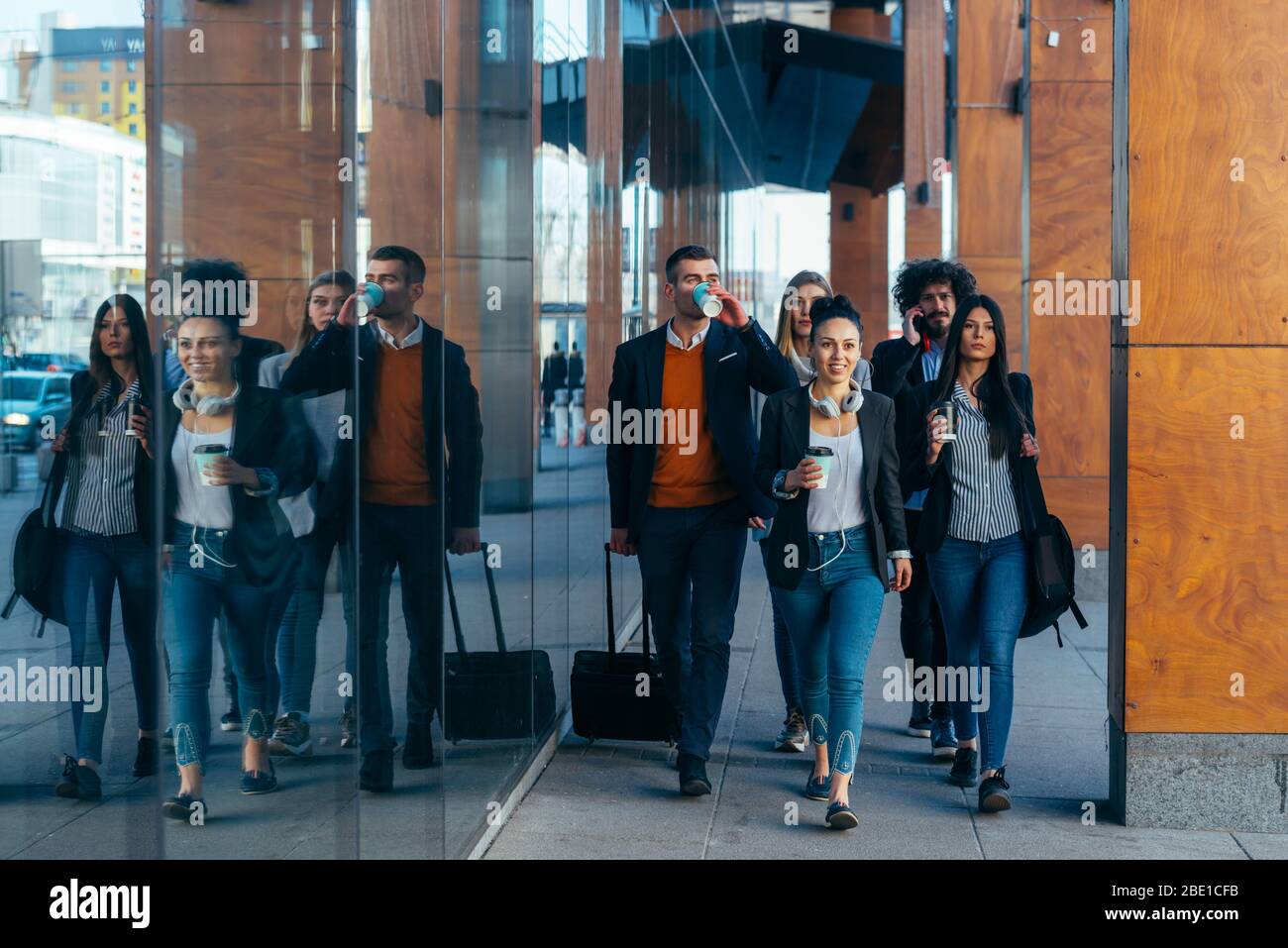 Group of colleagues on a business trip (euro trip) walking together at ...