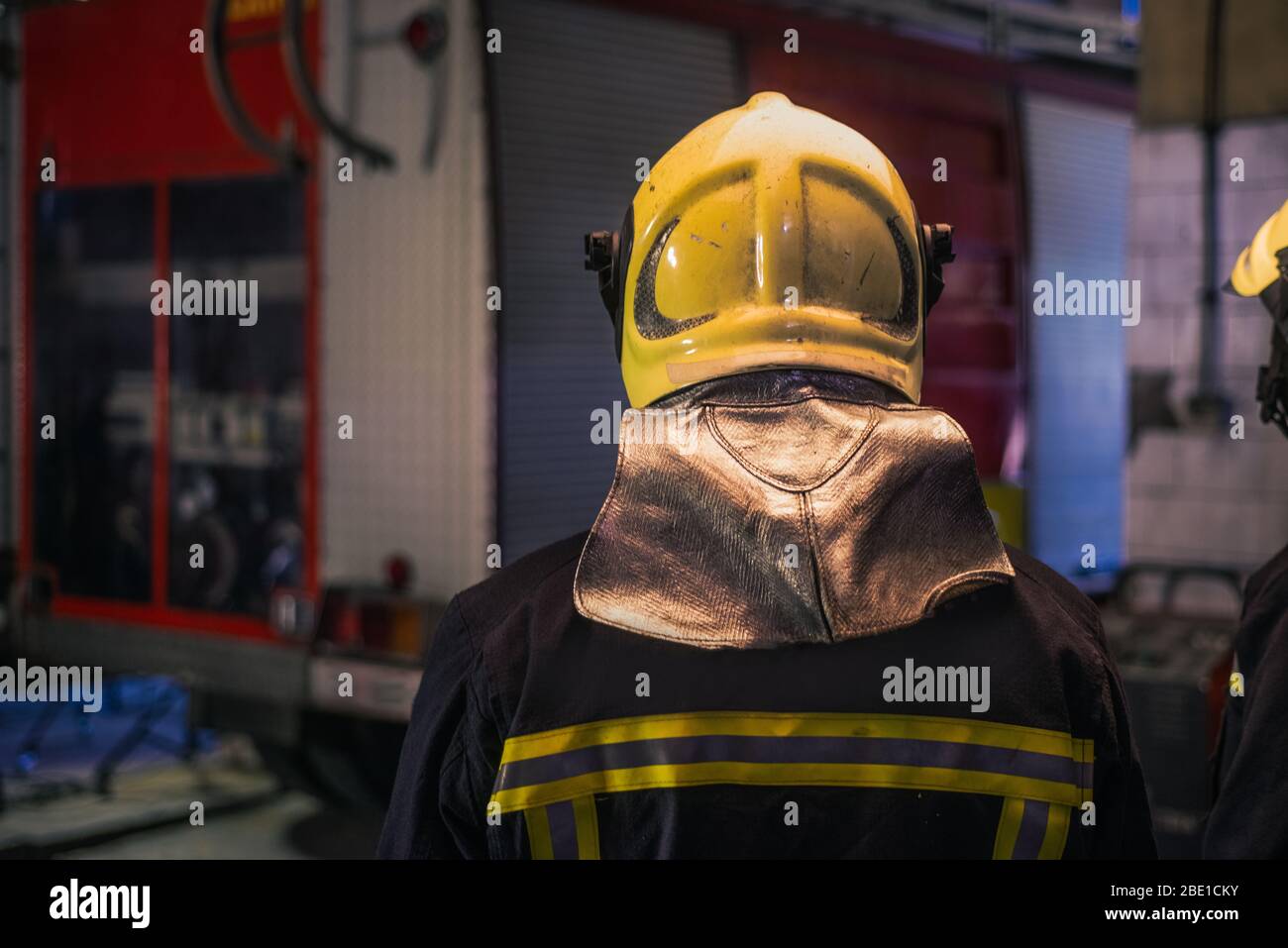 Young fire fighter wearing helmet hi-res stock photography and images ...