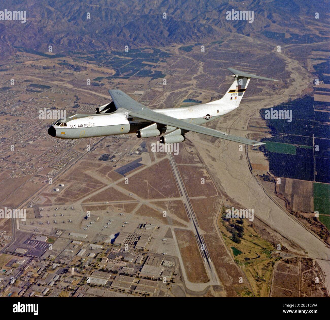 1980 - An air-to-air left side view of a C-141 Starlifter aircraft over ...