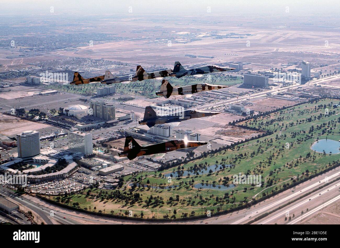 An air-to-air right side view of a seven-ship wedge formation of F-5E ...