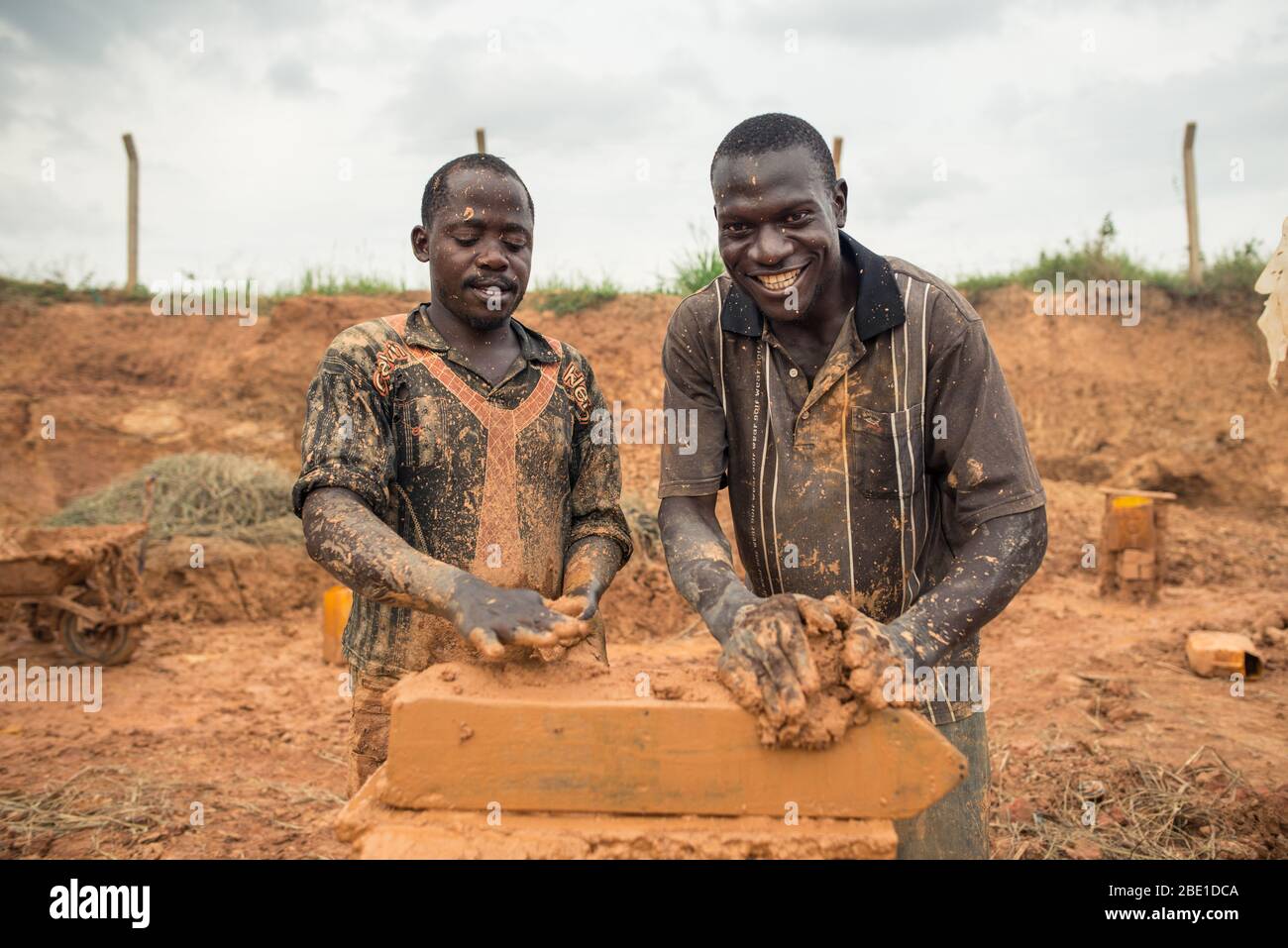 Kampala / Uganda - September 20, 2016: Black men working in mud brick ...