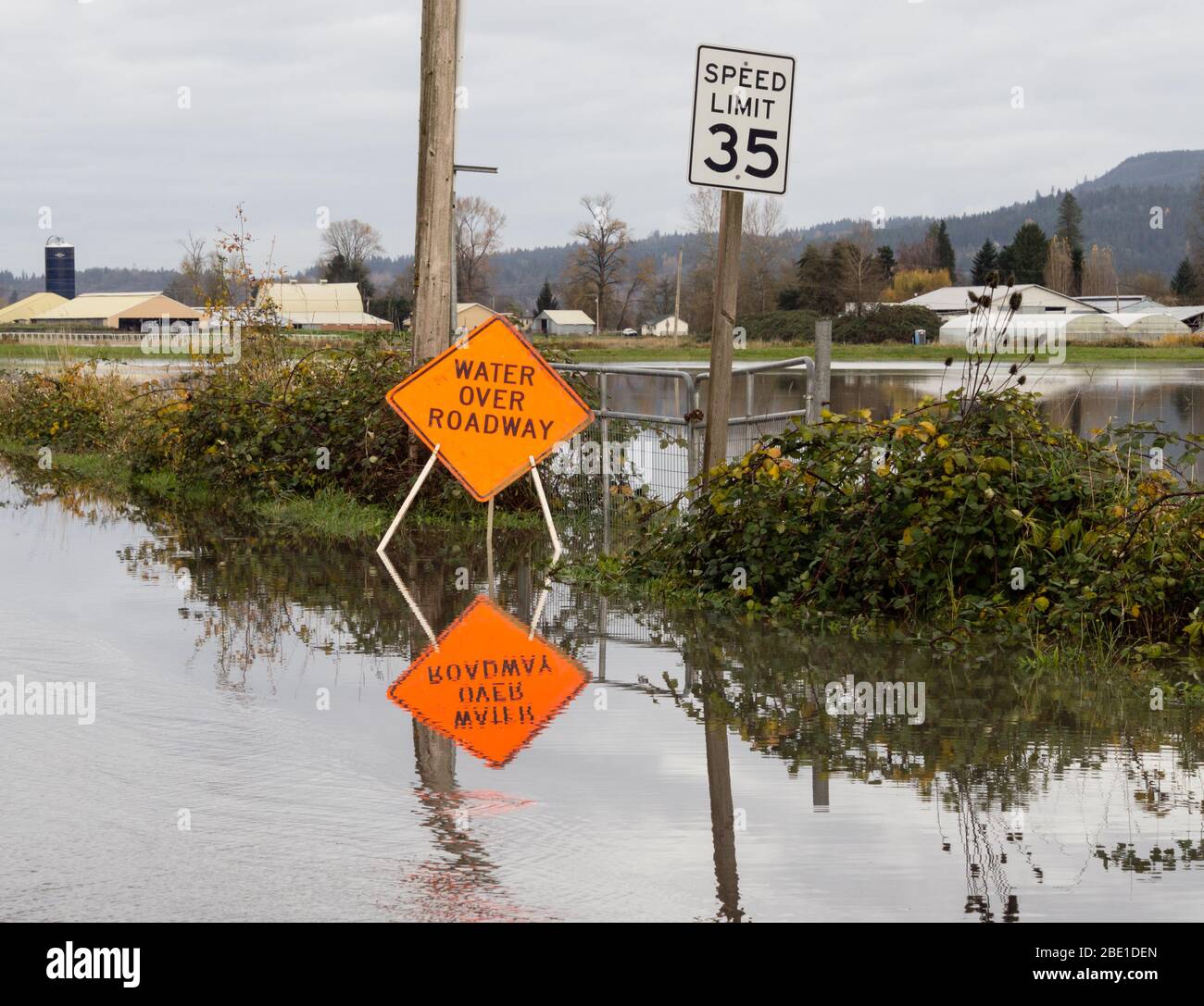 Water over roadway sign hi-res stock photography and images - Alamy