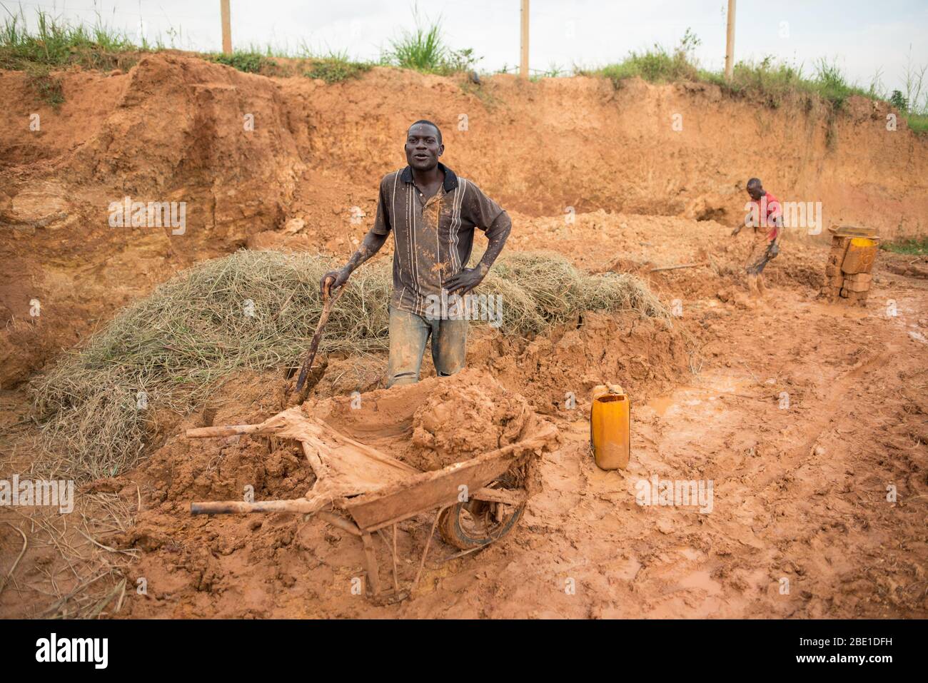 Kampala / Uganda - September 20, 2016: Black men working in mud brick ...