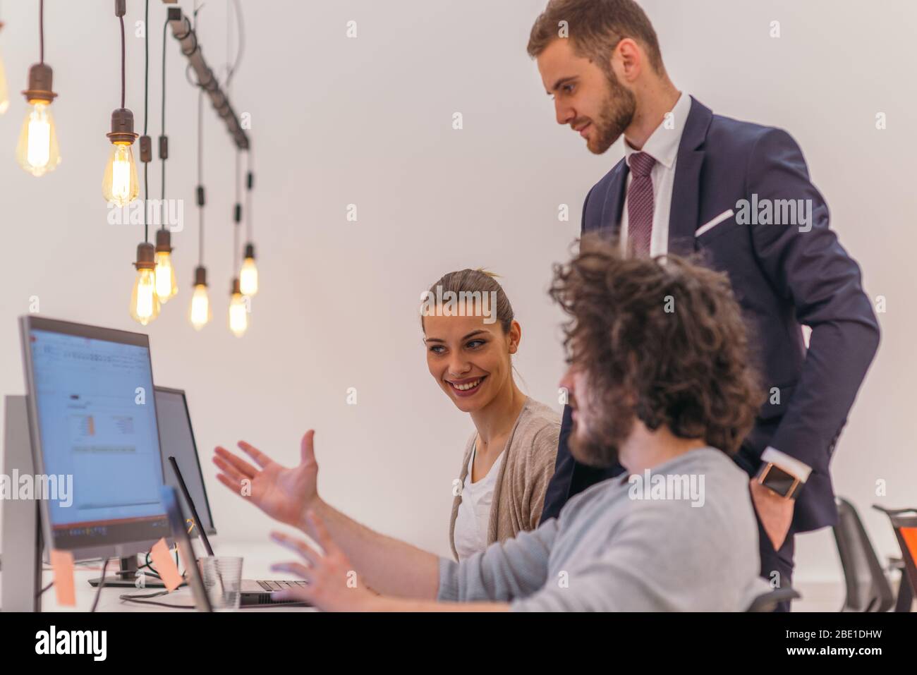 Manager overseeing his employees beautiful blonde and a coworker with ...