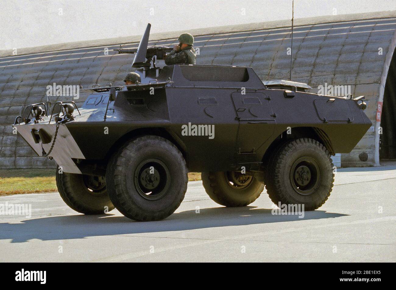 A security policeman patrols the area in an armored personnel carrier ...