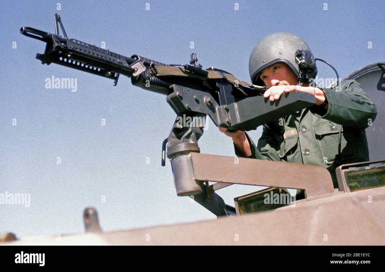 Korean 1LT Lee Young Nam operates an M-60 machine gun on an armored ...