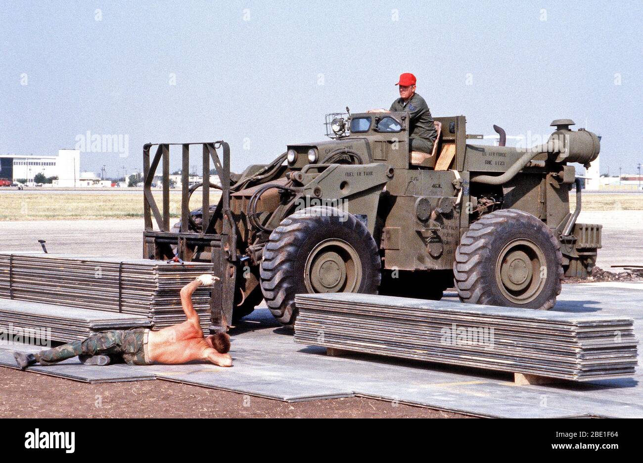 Marines install matting for a portable runway during a C-5A Galaxy ...