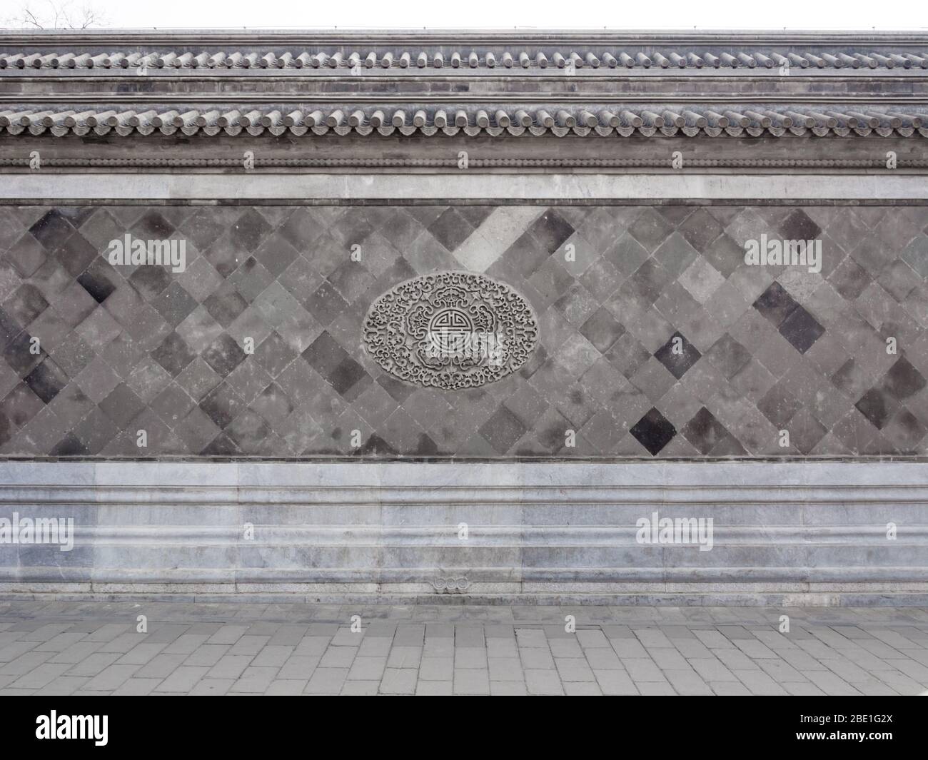 Classical chinese grey brick wall with ornaments Stock Photo - Alamy