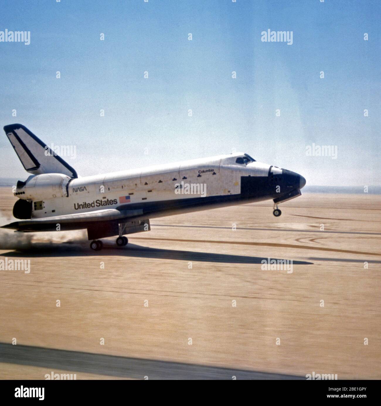 Right front view of the Space Shuttle Columbia landing on a runway at ...